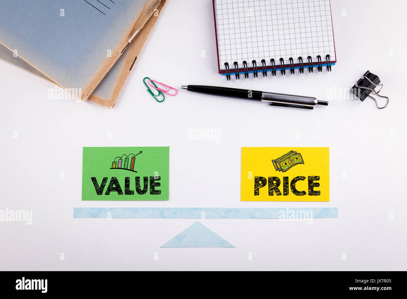 Value and Price Balance concept. Paper scale on a white table Stock ...