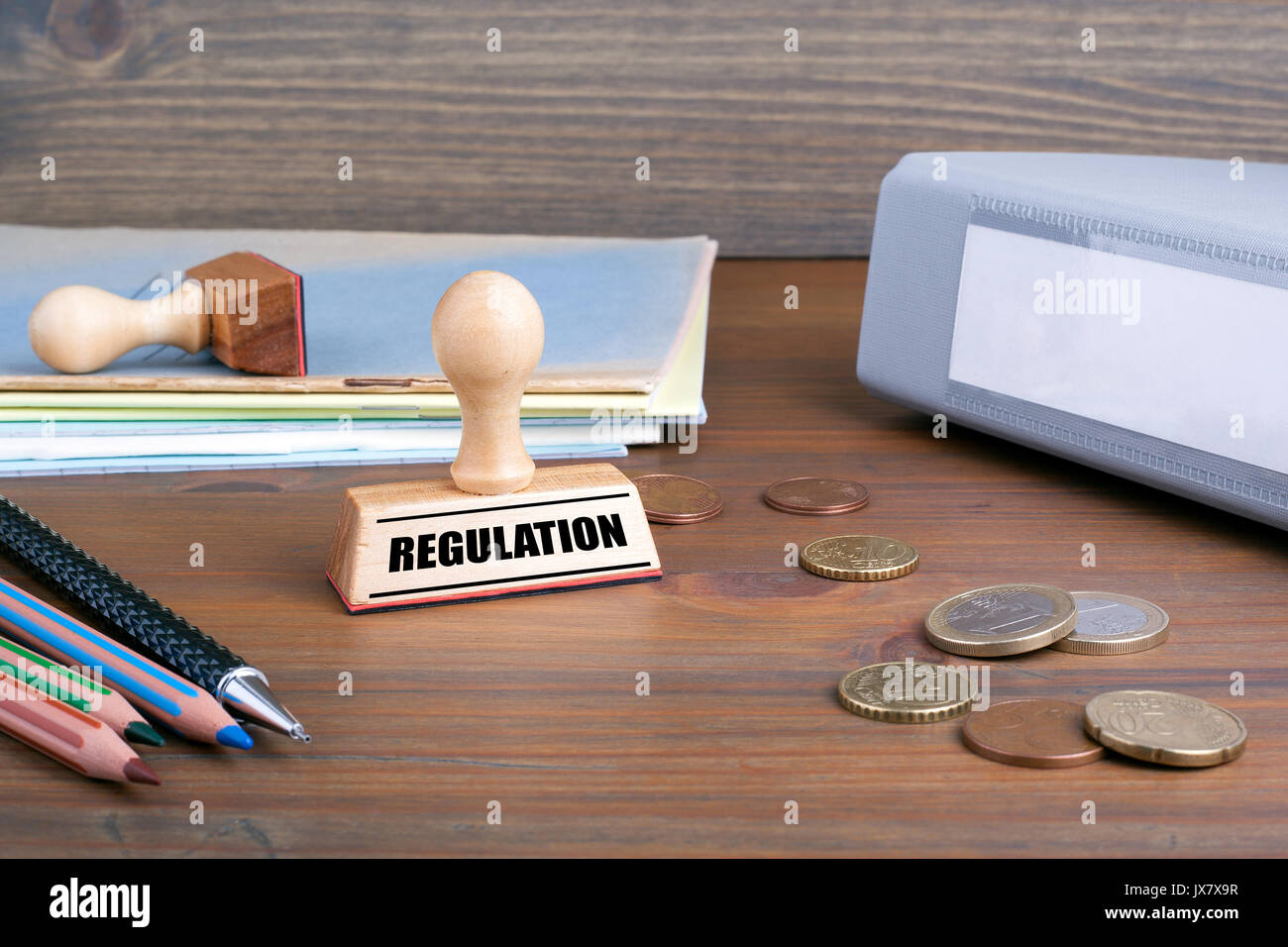 Regulation. Rubber Stamp on desk in the Office Stock Photo - Alamy