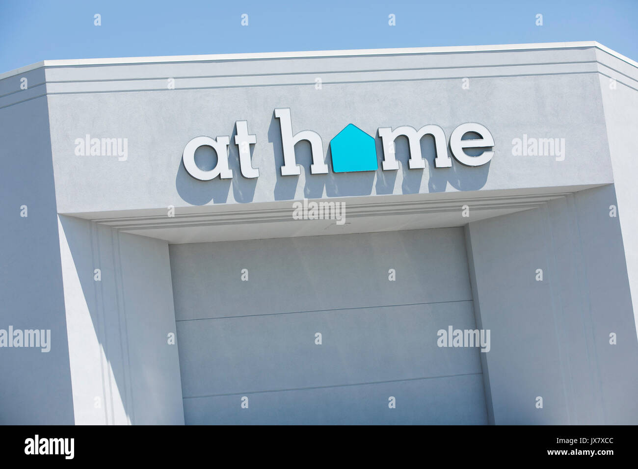 A logo sign outside of a At Home retail store in York, Pennsylvania on ...
