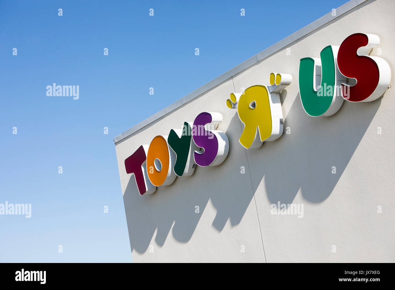A logo sign outside of a Toys "R" Us, Inc., retail store in Lancaster ...