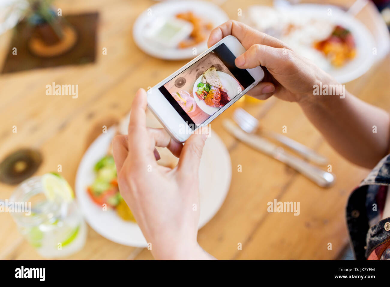 hands with smartphone picturing food at restaurant Stock Photo - Alamy