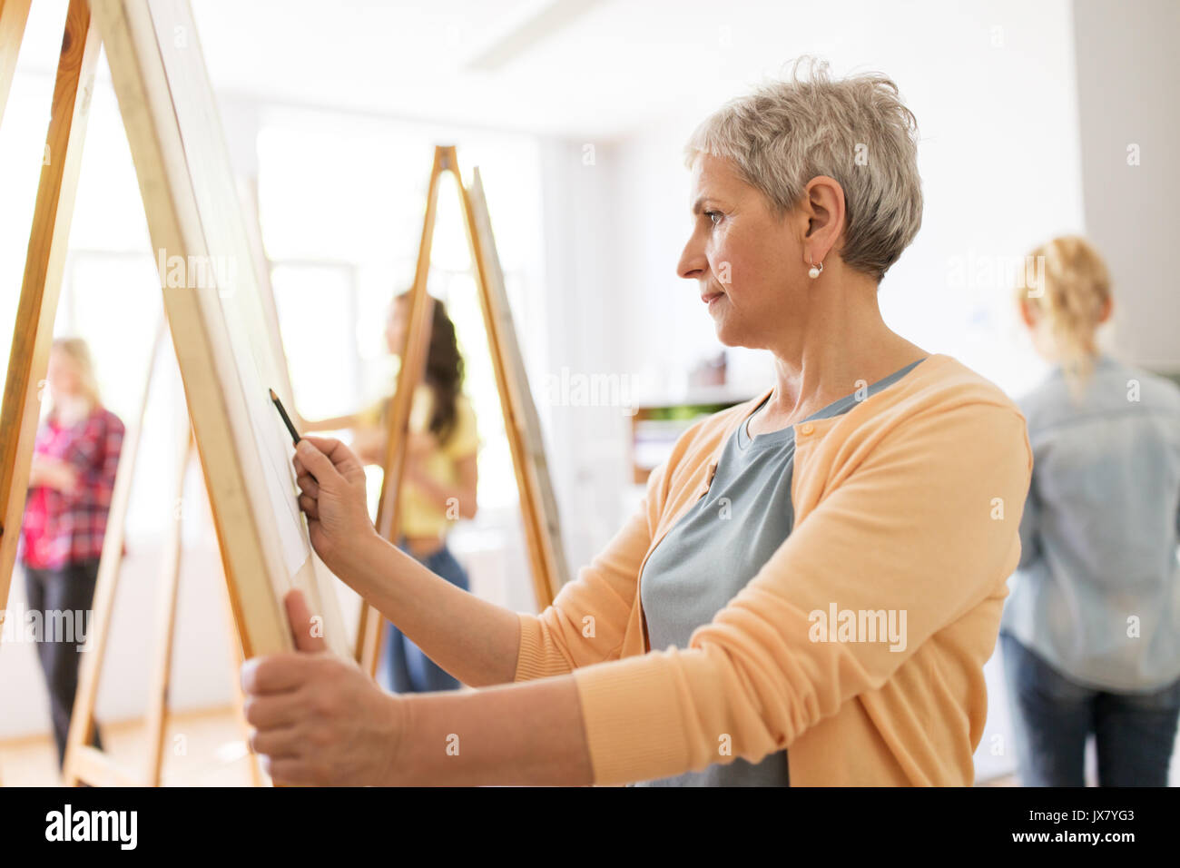 woman artist with pencil drawing at art school Stock Photo - Alamy