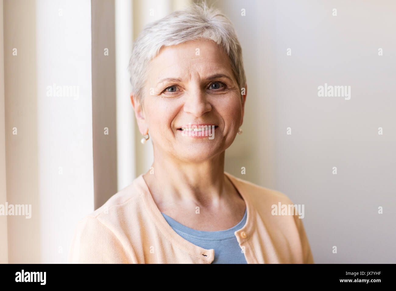 portrait of happy smiling gray senior woman Stock Photo - Alamy