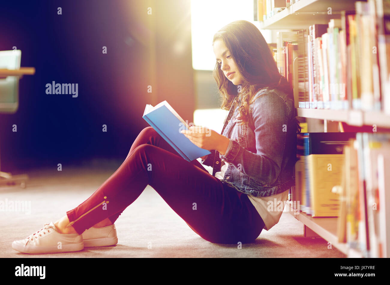high school student girl reading book at library Stock Photo - Alamy