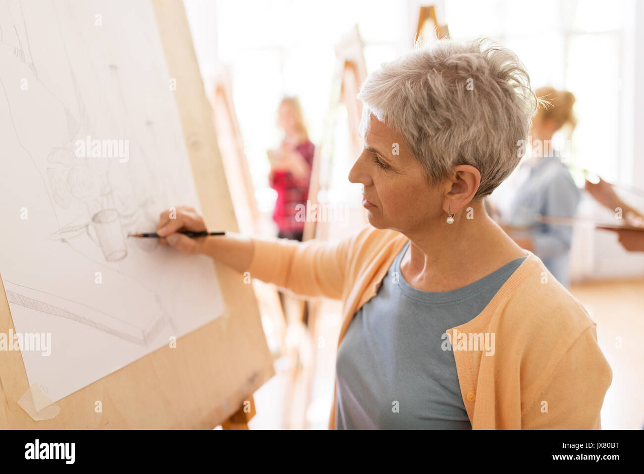 woman artist with pencil drawing at art school Stock Photo - Alamy