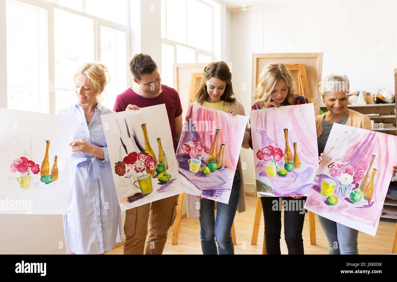 group of artists with pictures at art school Stock Photo - Alamy