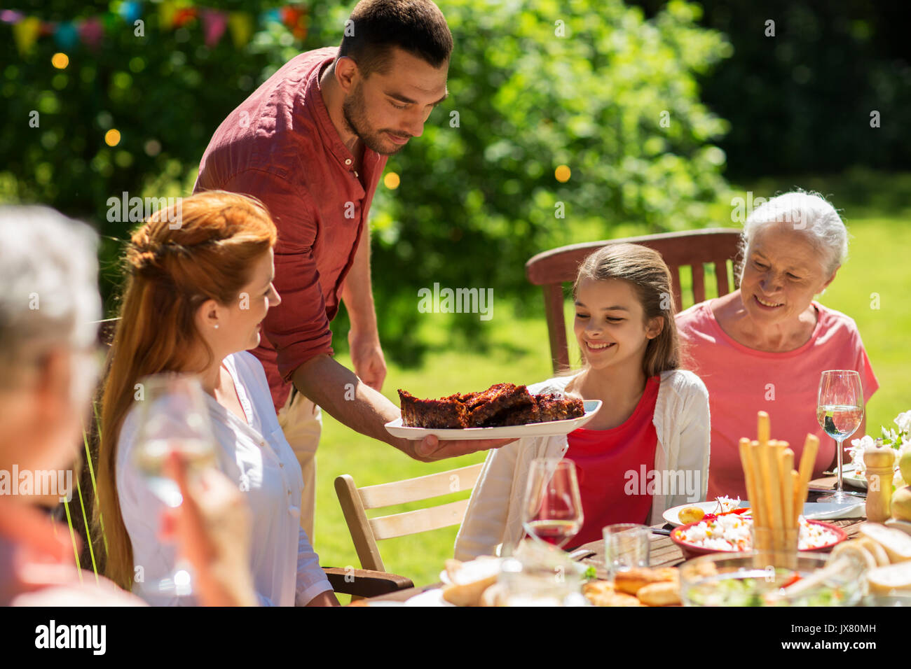 Family table dinner people eating meat hi-res stock photography and ...