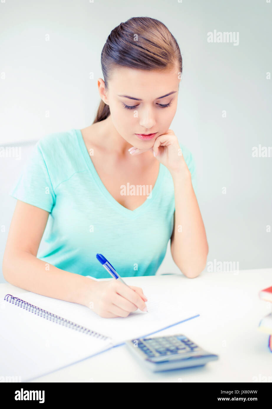 student girl with notebook and calculator Stock Photo - Alamy