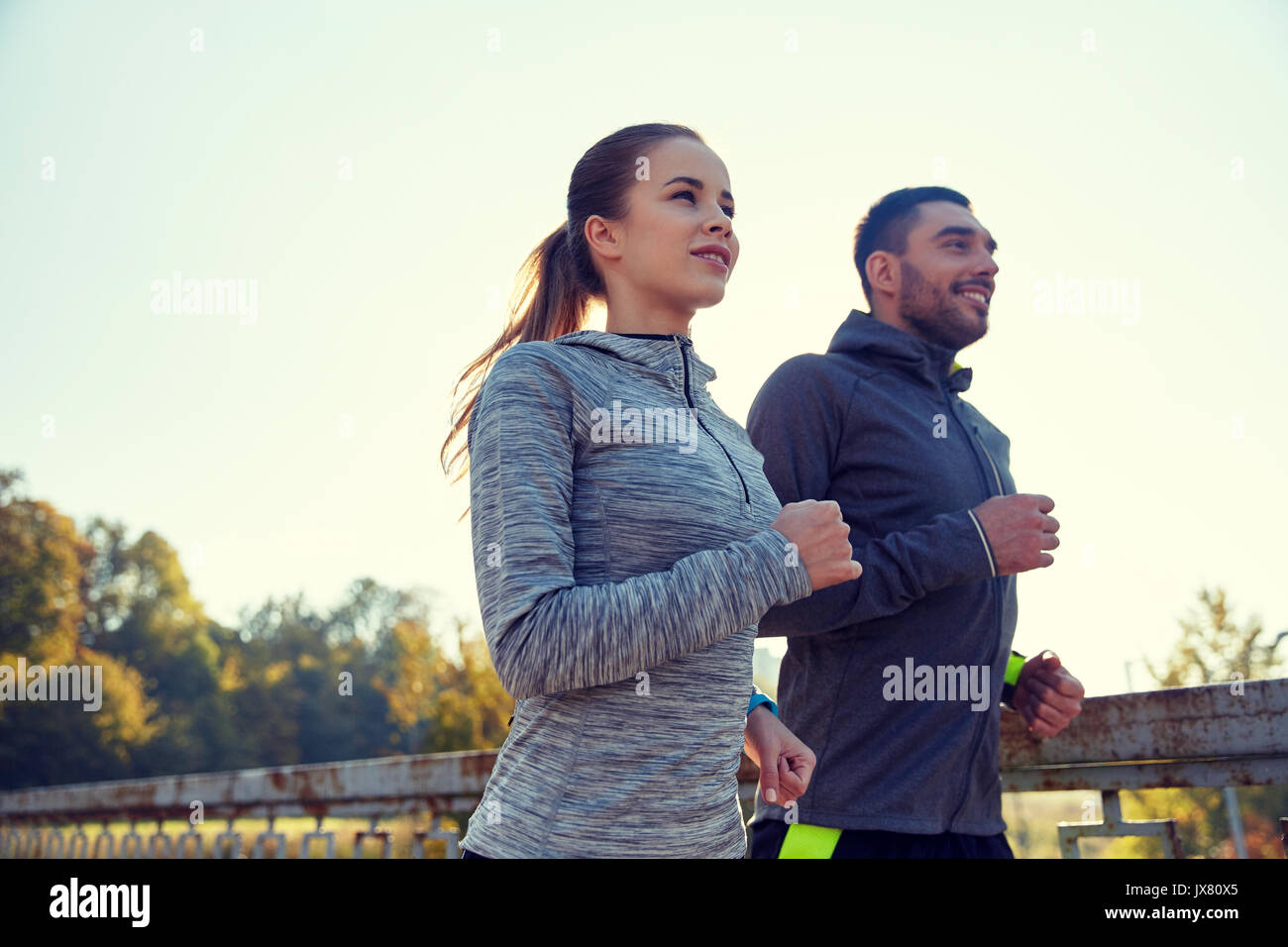 Running happy people hi-res stock photography and images - Alamy