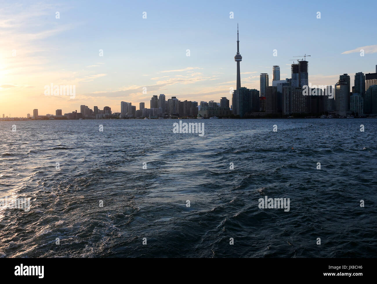 A view of the Toronto Skyline at sunset from Lake Ontario in Toronto ...