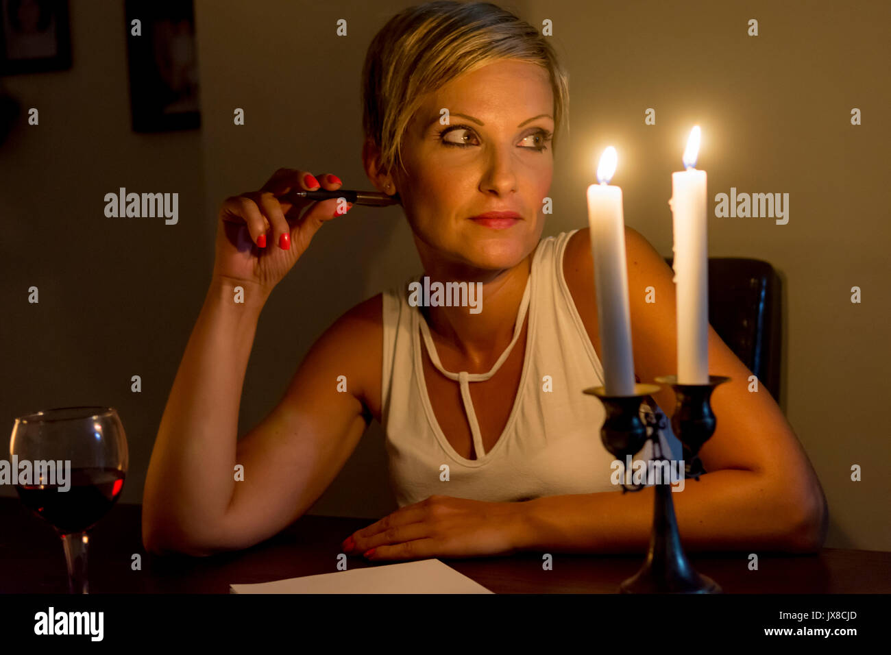 woman is thinking what to write Stock Photo - Alamy