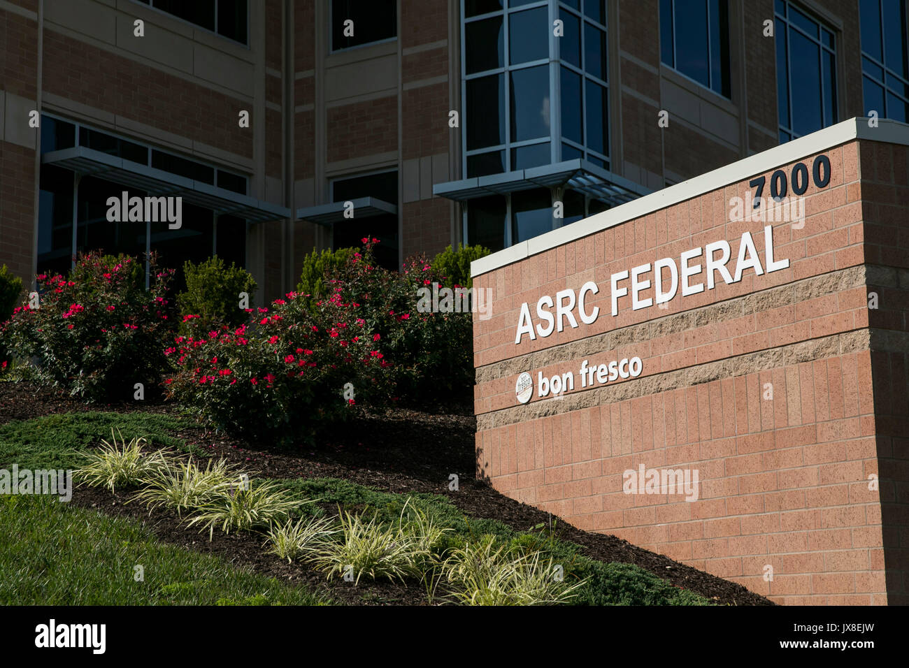 A logo sign outside of the headquarters of ASRC Federal in Beltsville ...