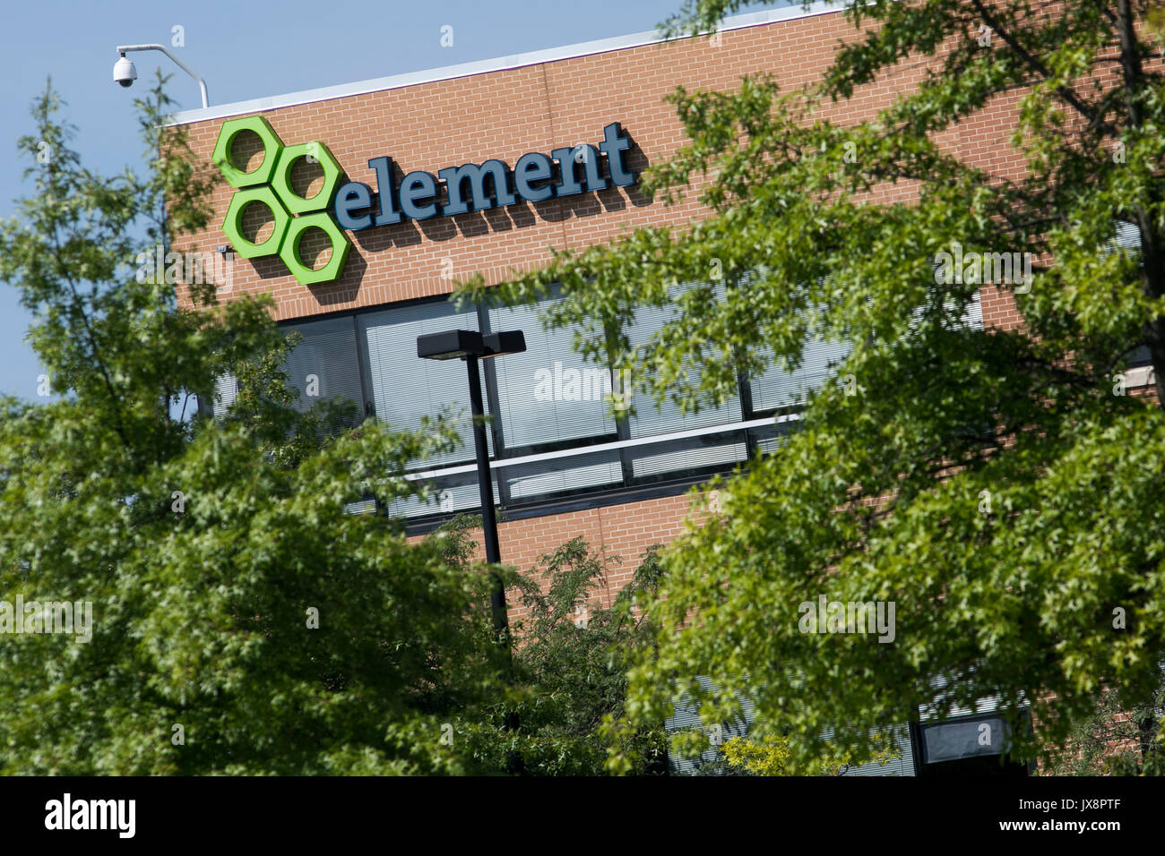A logo sign outside of a facility occupied by Element Fleet Management ...
