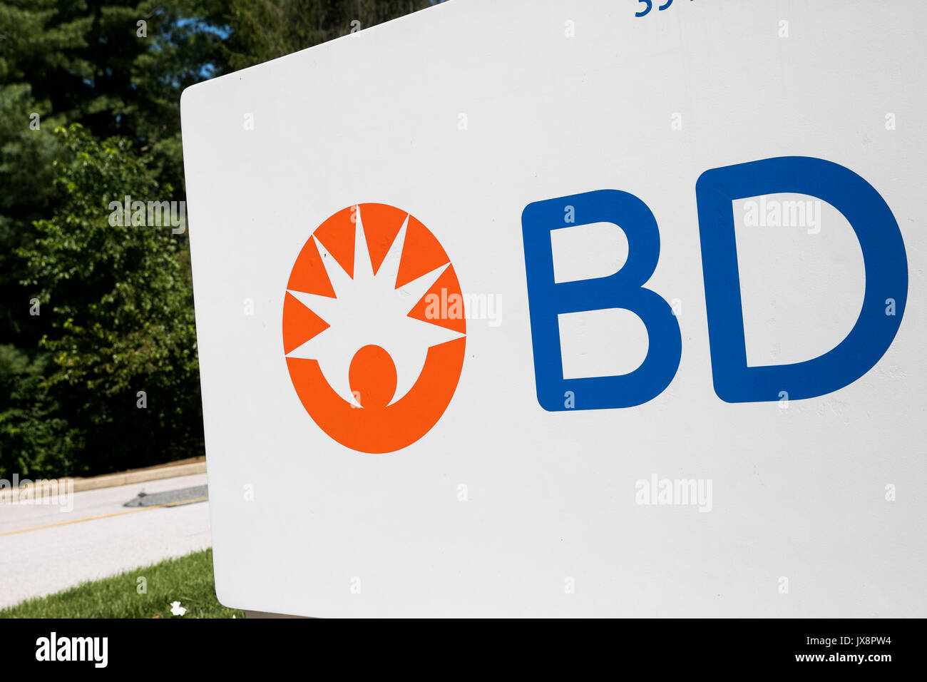 A logo sign outside of a facility occupied by Becton, Dickinson and ...