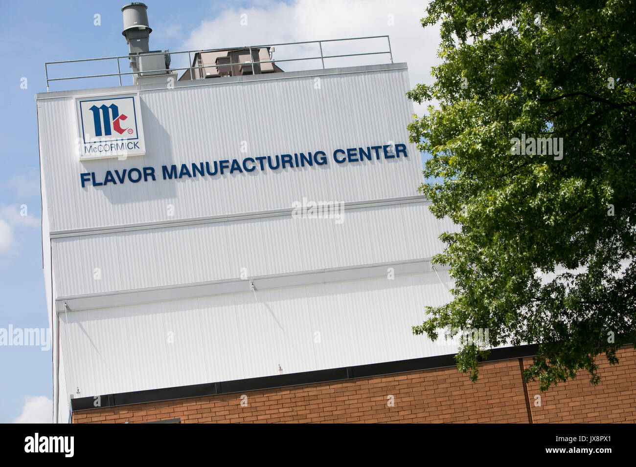 A logo sign outside of a facility occupied by McCormick & Company in ...