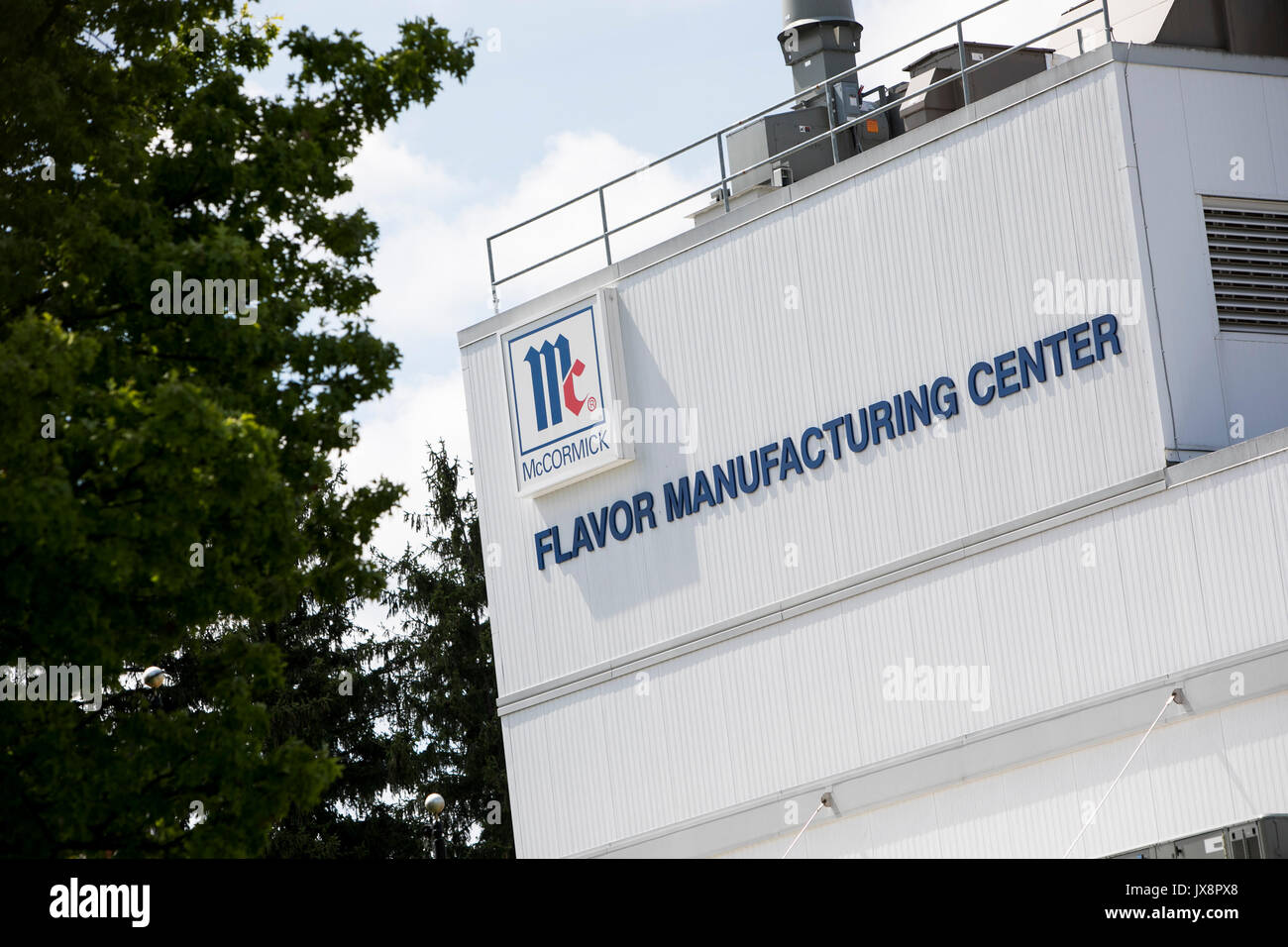 A logo sign outside of a facility occupied by McCormick & Company in ...