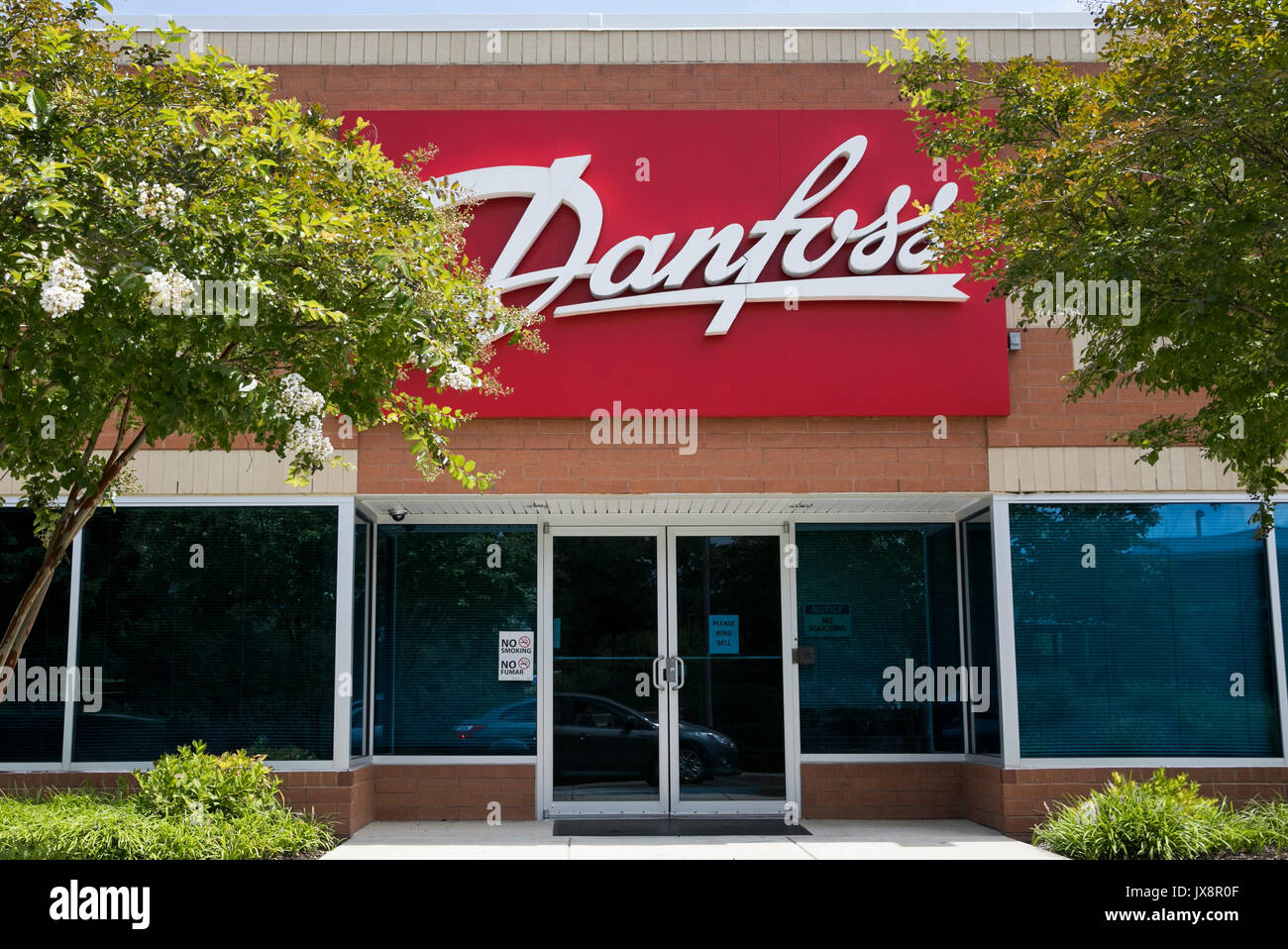 A logo sign outside of a facility occupied by The Danfoss Group in ...