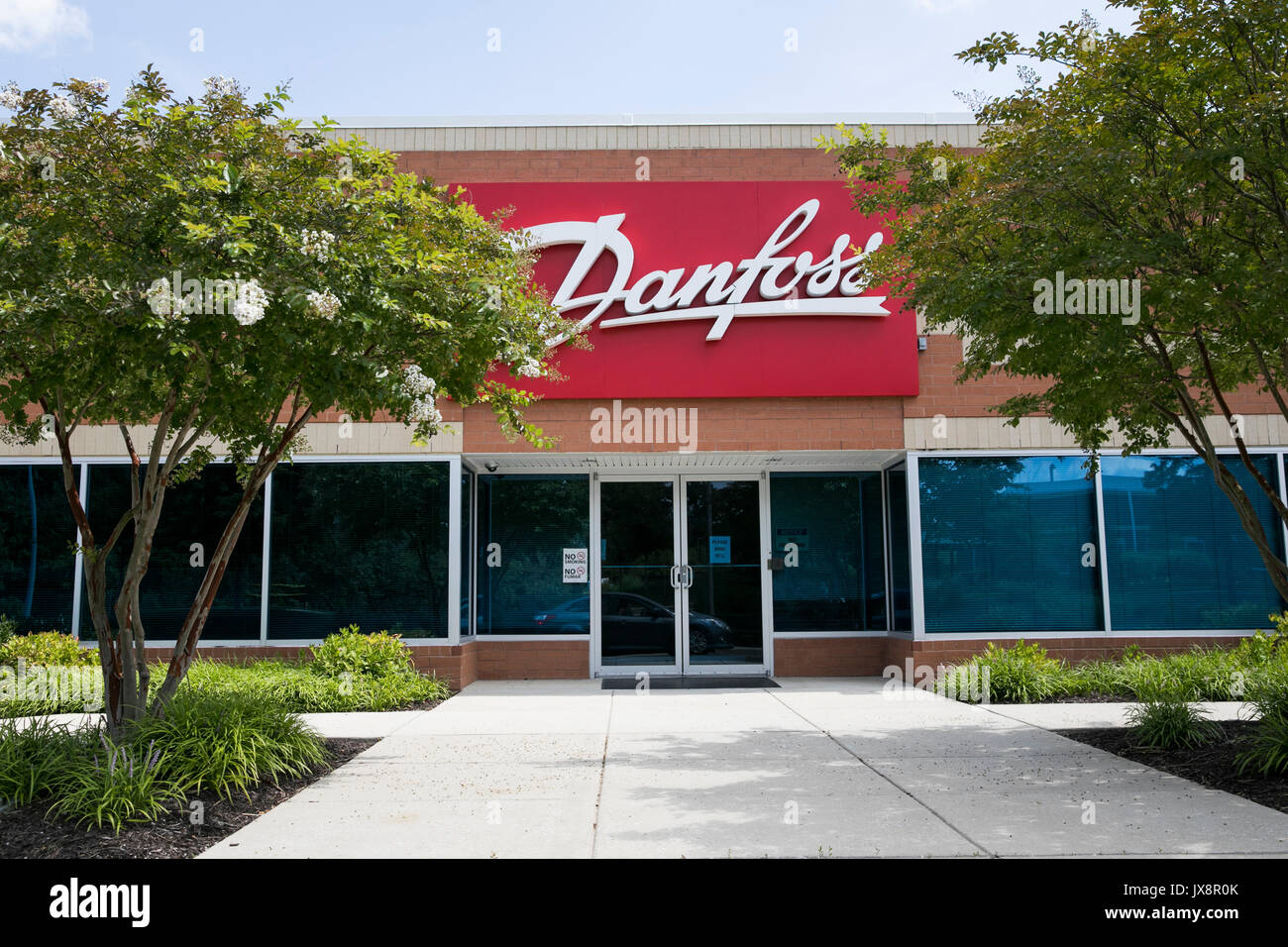 A logo sign outside of a facility occupied by The Danfoss Group in ...