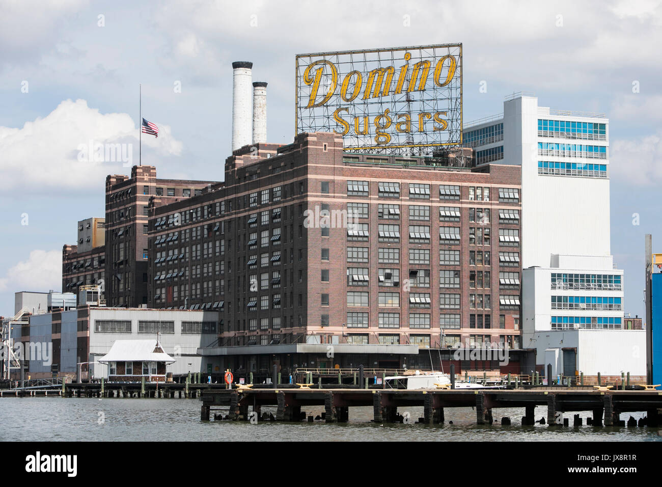 A logo sign outside of a facility occupied by Domino Sugars in ...