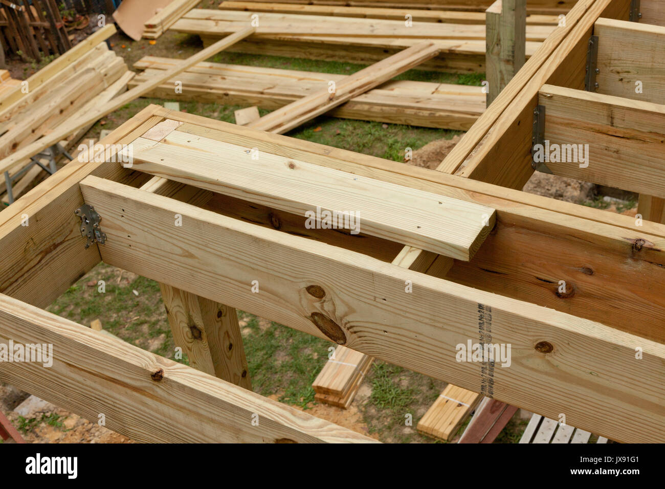Lumber framing on a new deck with metal support Stock Photo - Alamy