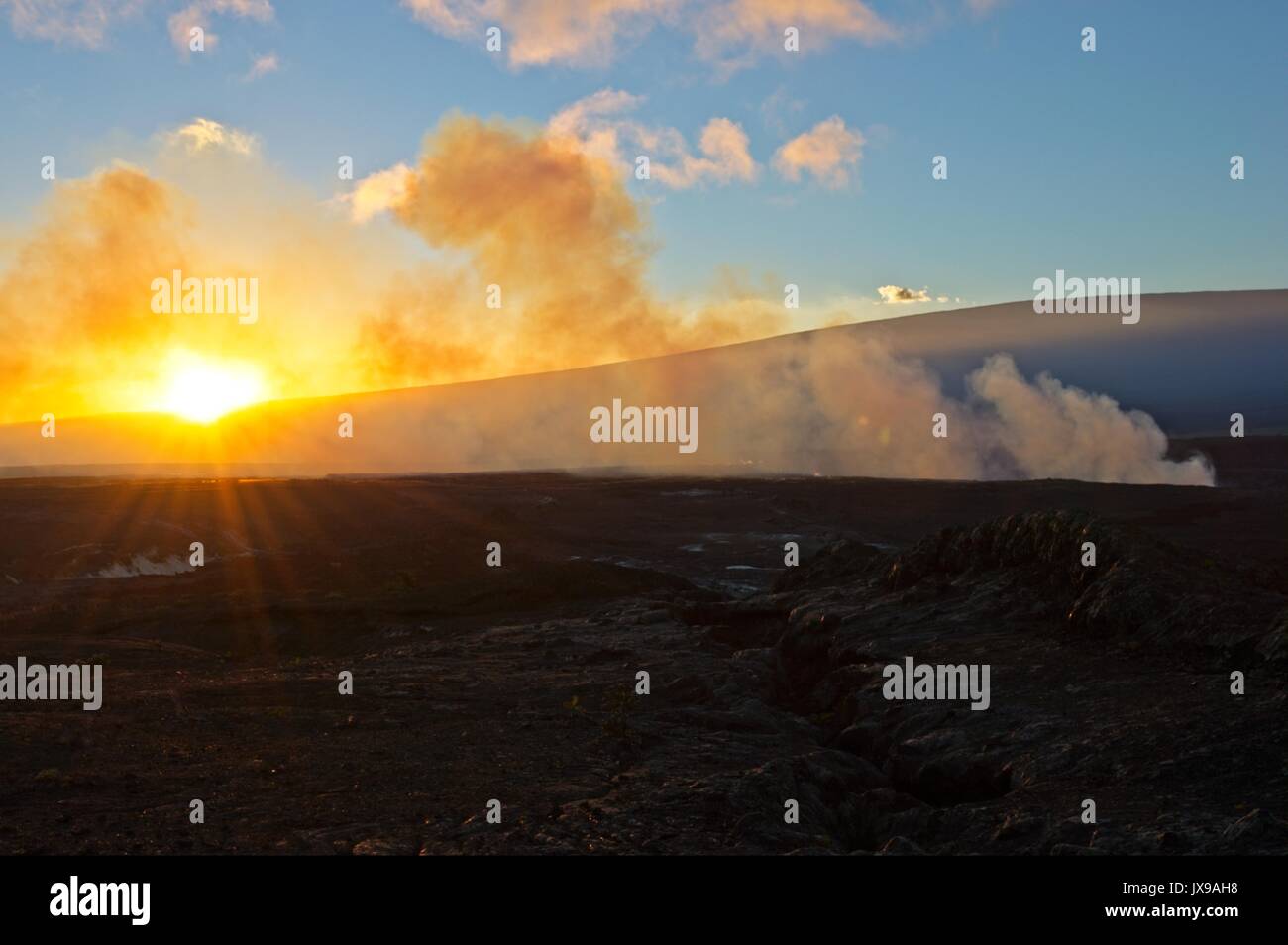 Red hot lava, steam, smoke and fire from the Kilauea volcano at the rim ...