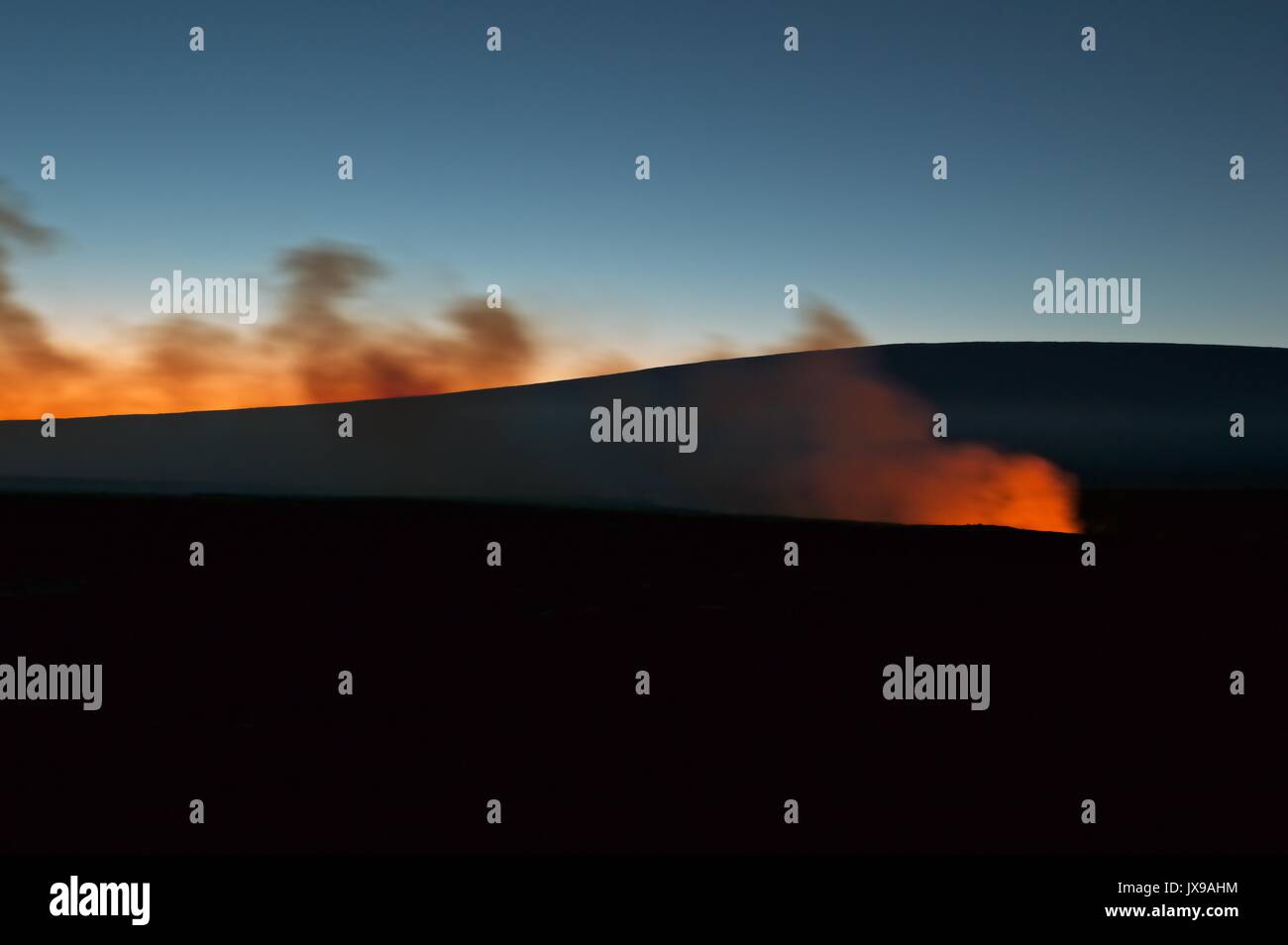 Red hot lava, steam, smoke and fire from the Kilauea volcano at the rim ...