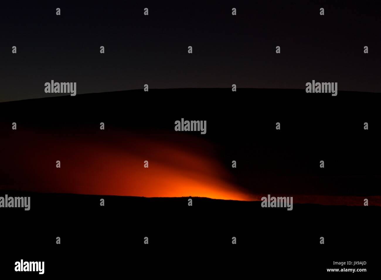 Red hot lava, steam, smoke and fire from the Kilauea volcano at the rim ...