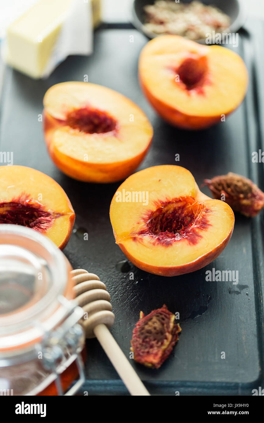 Cutting peaches in half making hi-res stock photography and images - Alamy