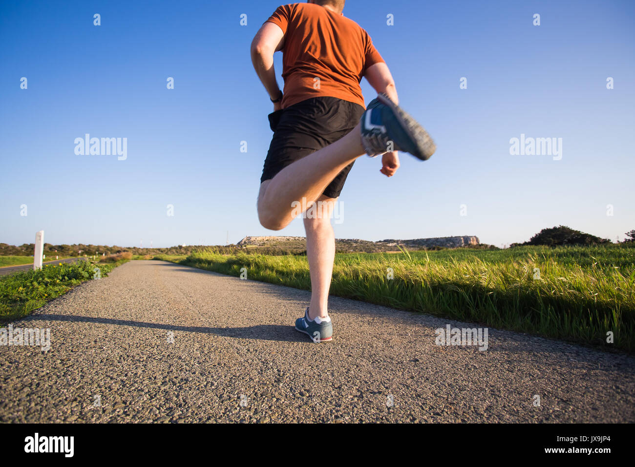 Athletic young man running in the nature. Healthy lifestyle Stock Photo ...
