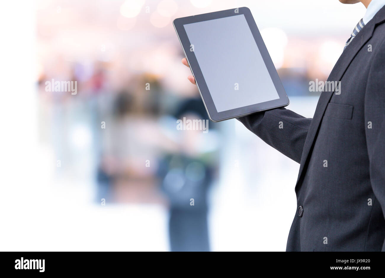 isolated business man hold the tablet on shopping mall background Stock ...