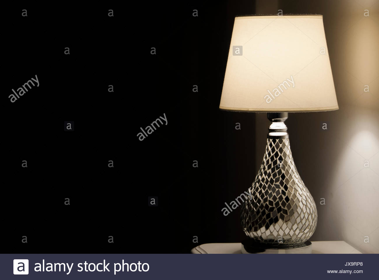 Modern illuminated lamp at night inside a house Stock Photo - Alamy