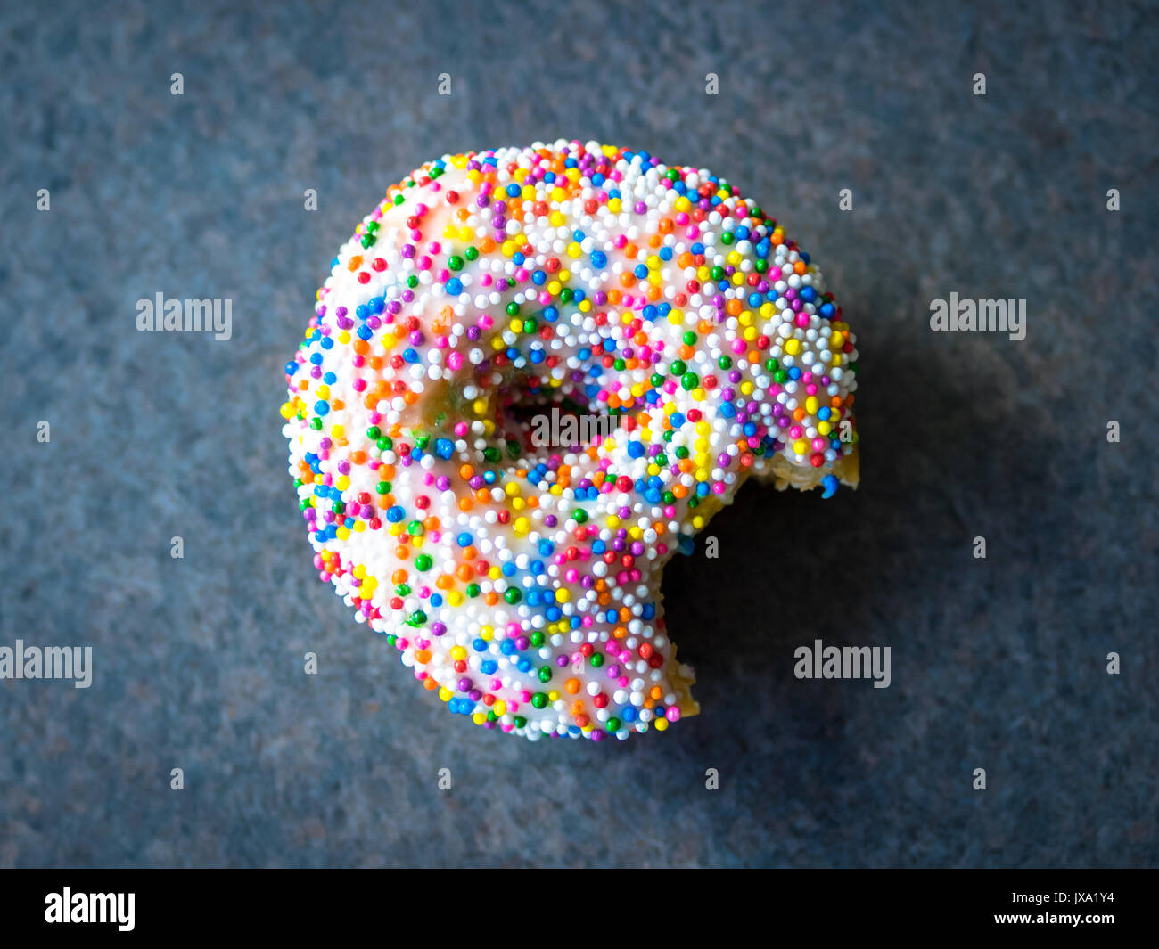 A vanilla dip donut (sprinkle donut, rainbow sprinkle donut) from Tim ...
