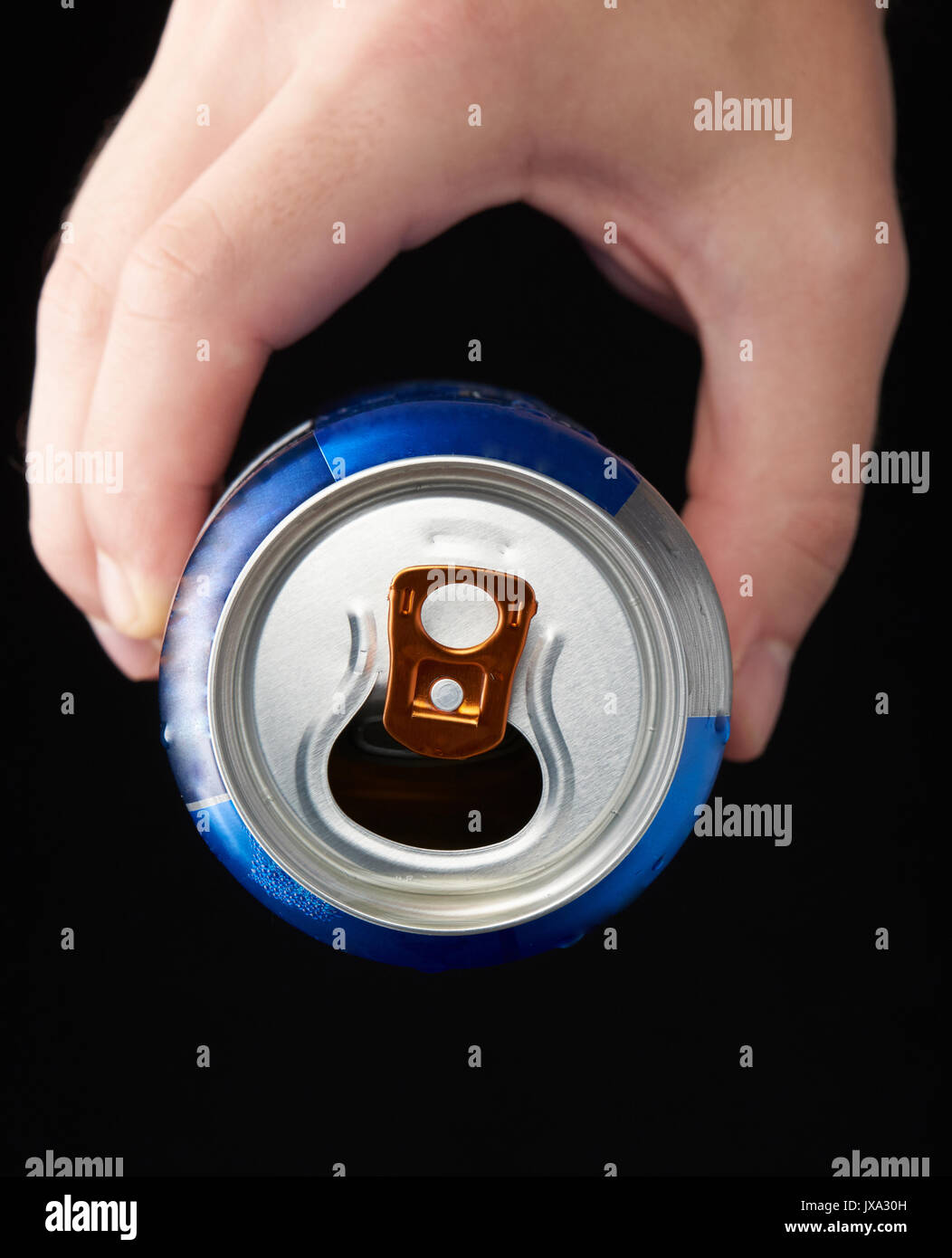 Hand hold metal open can isolated on black background above view Stock ...