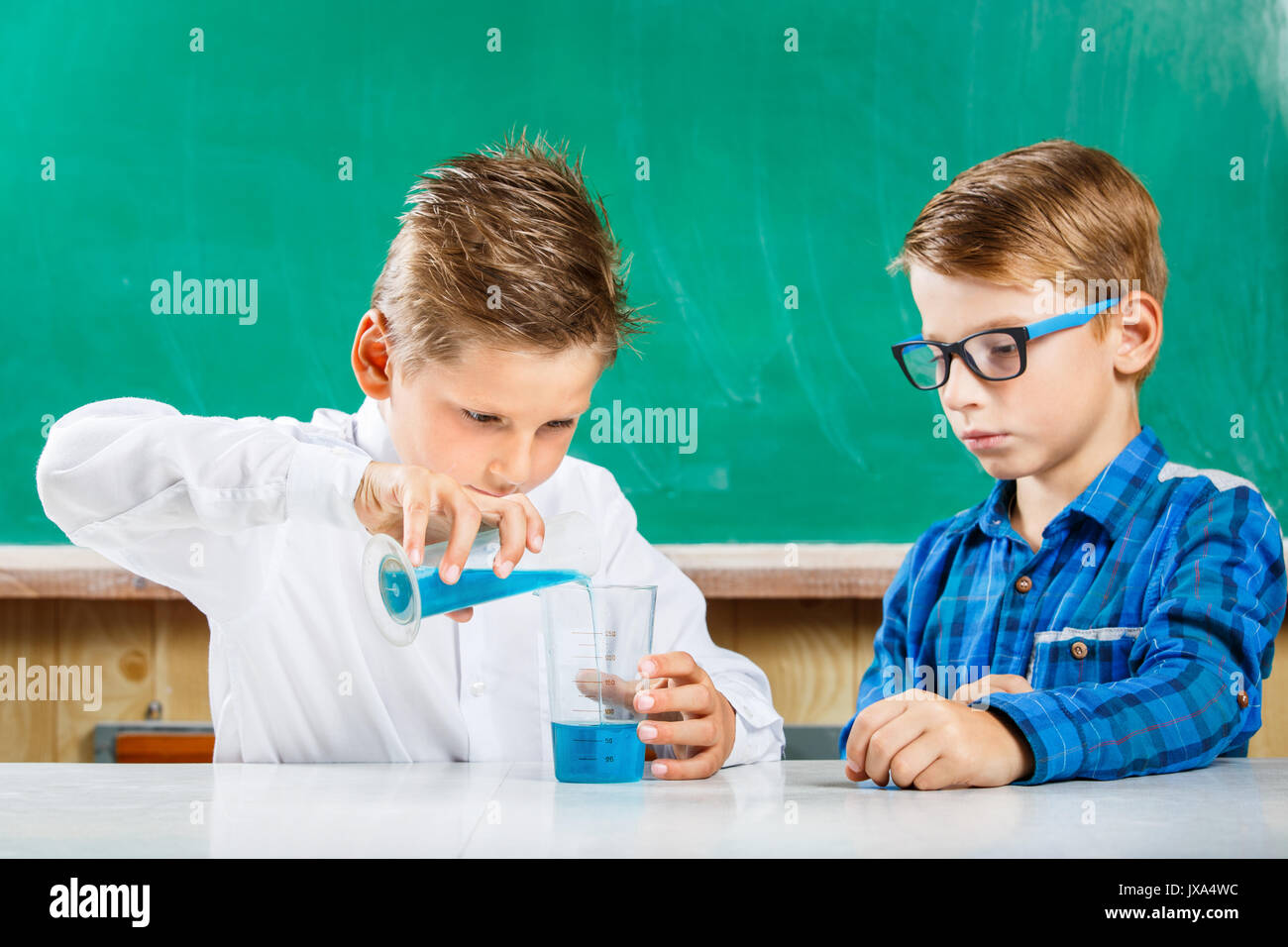 Pouring water on students hi-res stock photography and images - Alamy
