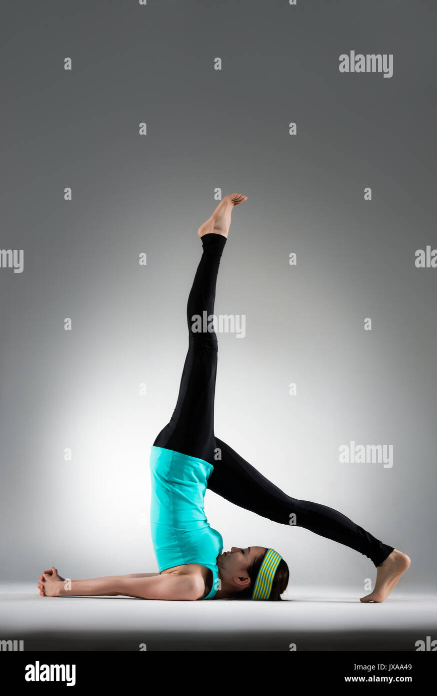 professional fitness women coach workout body in grey background ...