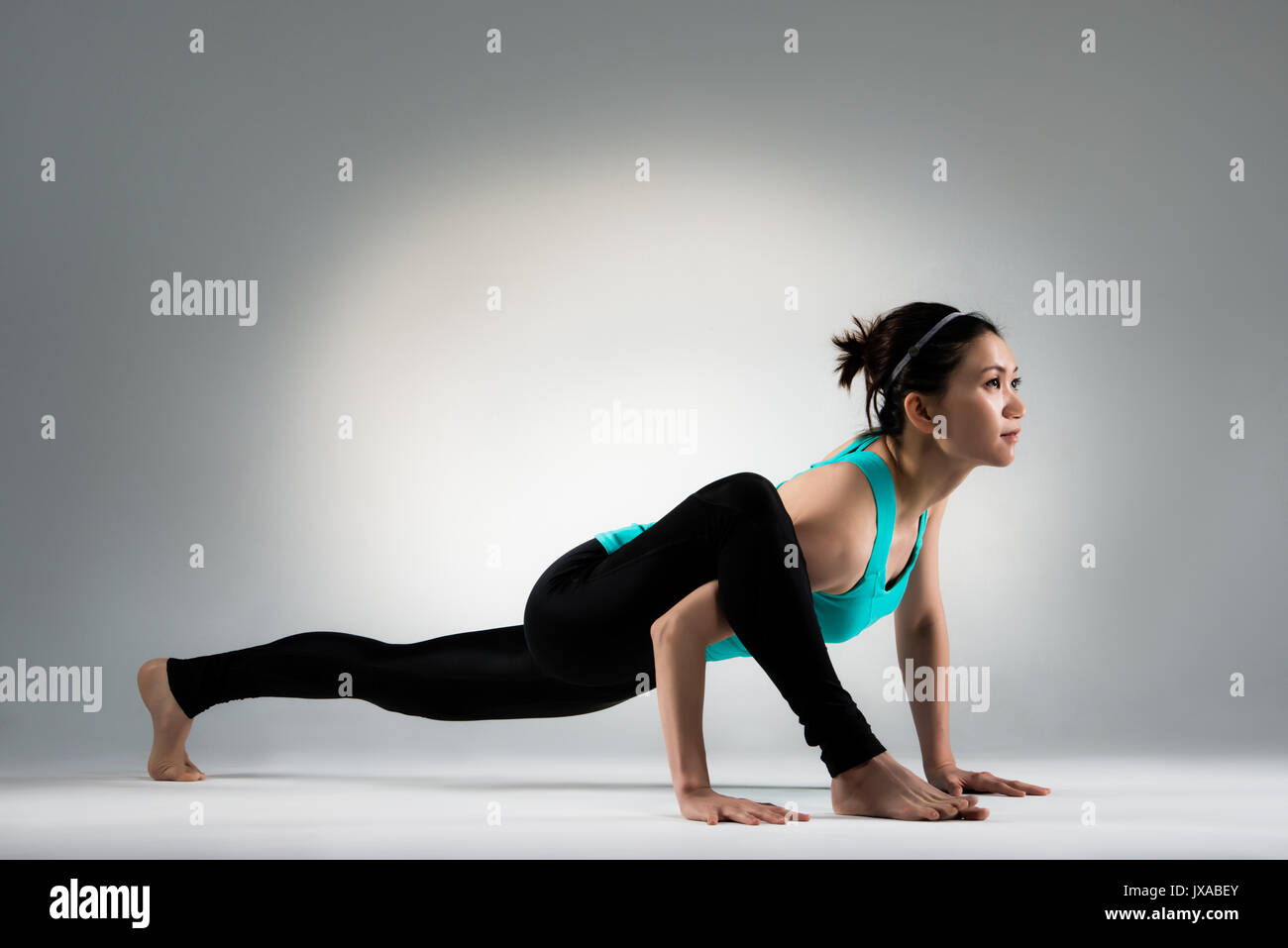 beautiful bodybuilding player hands support body and put leg around ...