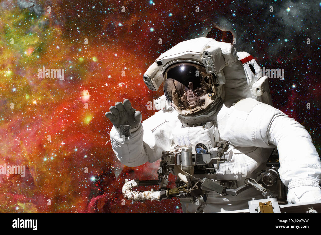 Astronaut in outer space. Galaxy and stars on the background. Elements ...
