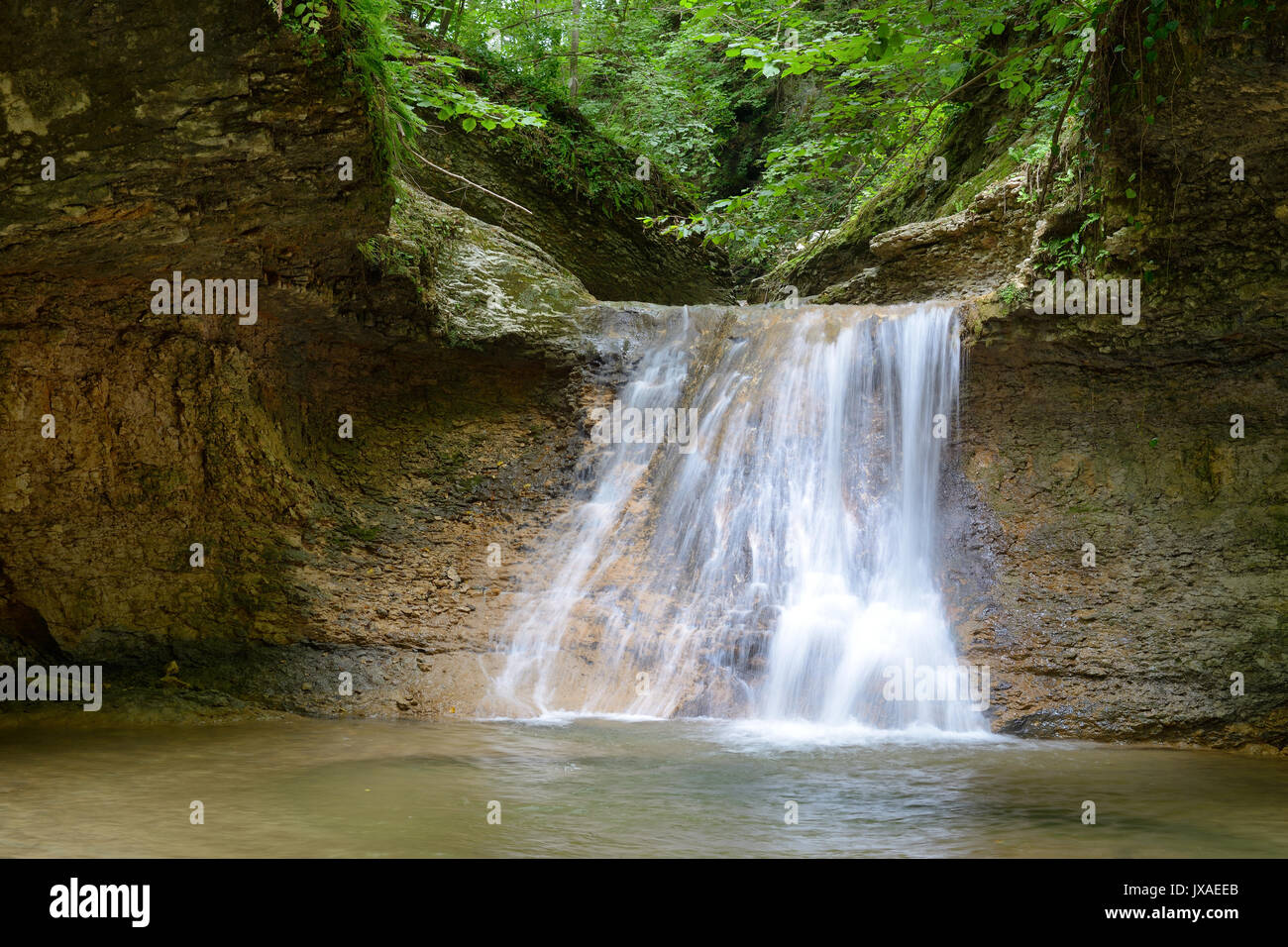 Small waterfall in forest Stock Photo - Alamy