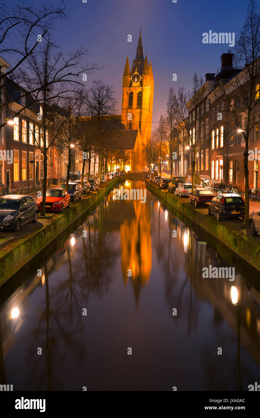 The Old Church reflected in a canal in Delft in The Netherlands at ...