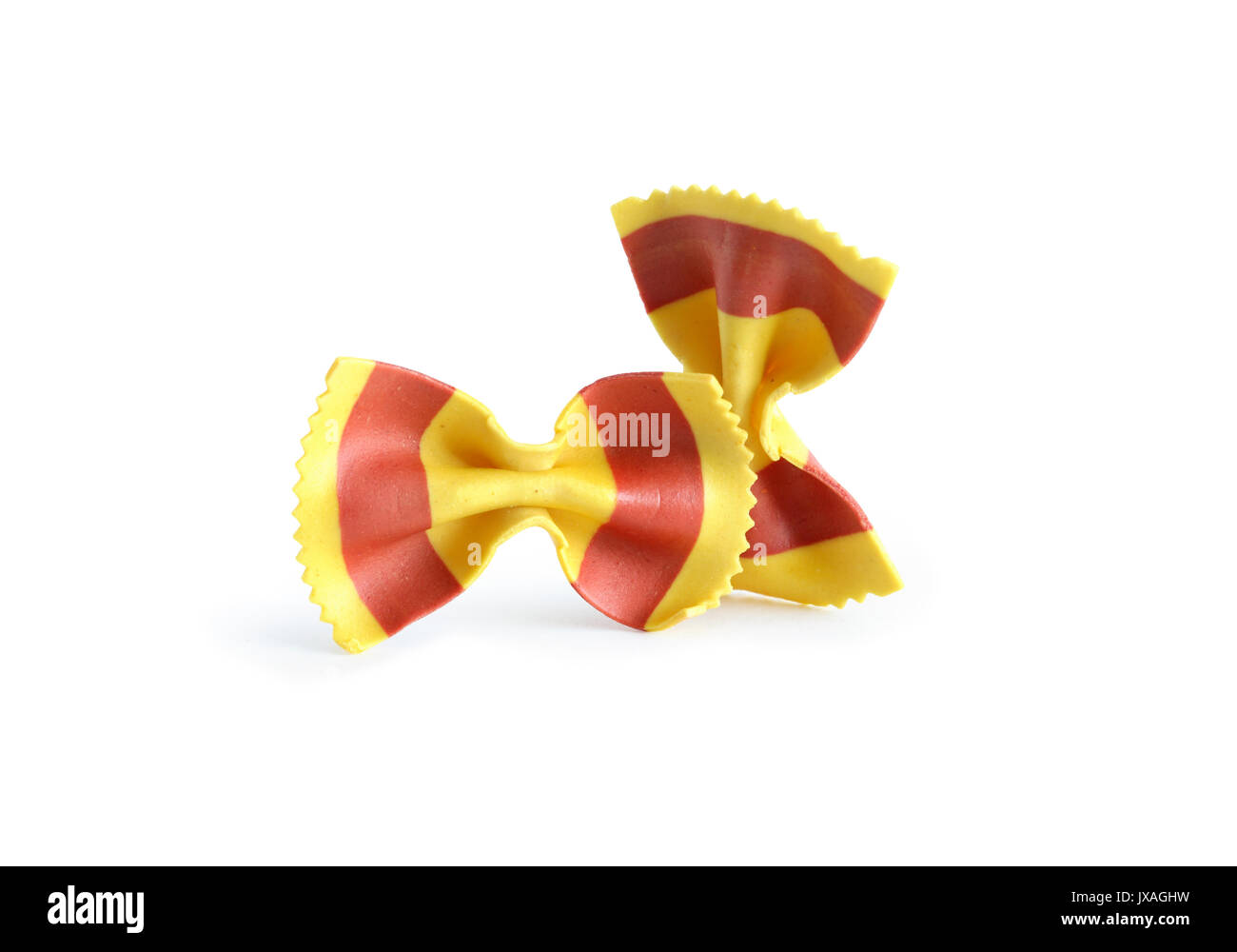 Closeup of Italian colorful bow tie pasta on white background. Isolated ...