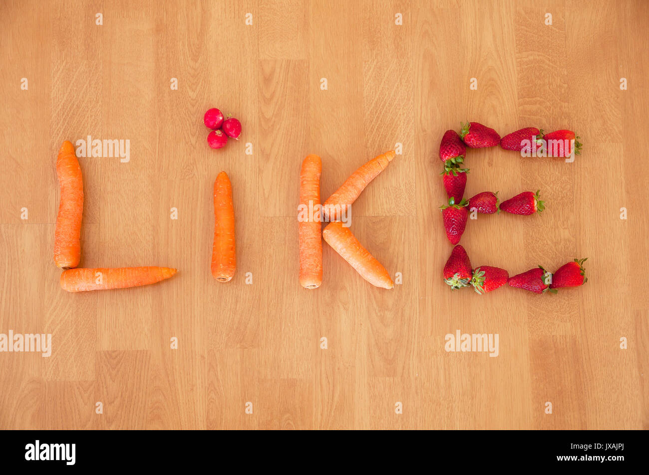 The word "Like" written using carrots and strawberries Stock Photo - Alamy