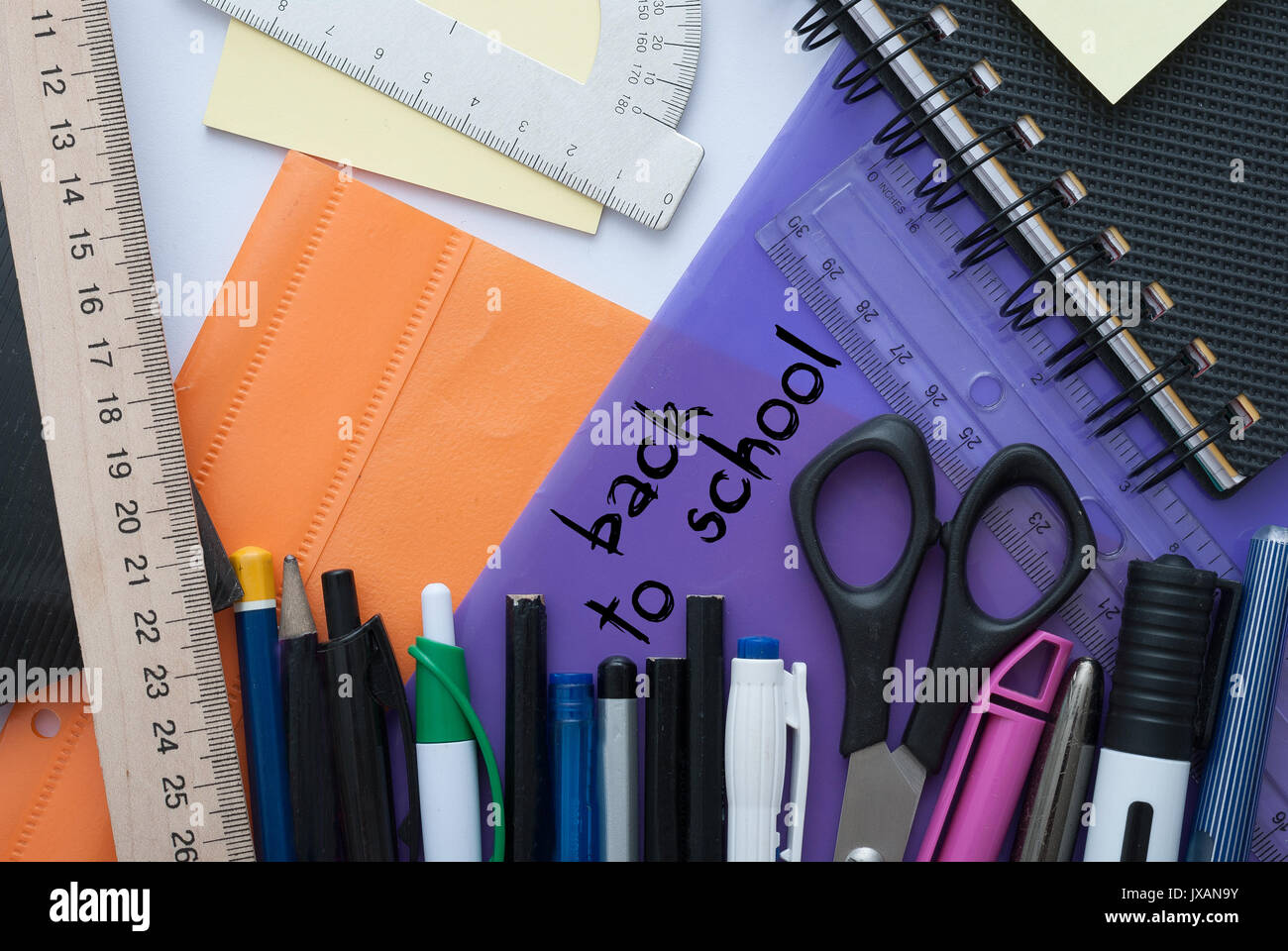 School set with back to school inscription in notebook and stationery ...