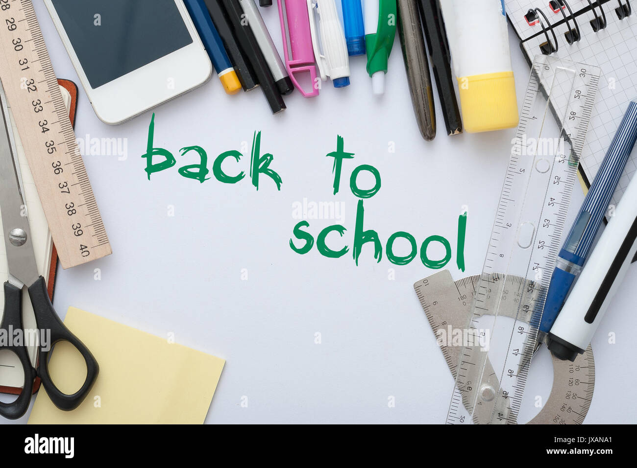 School set with back to school inscription in notebook and stationery ...