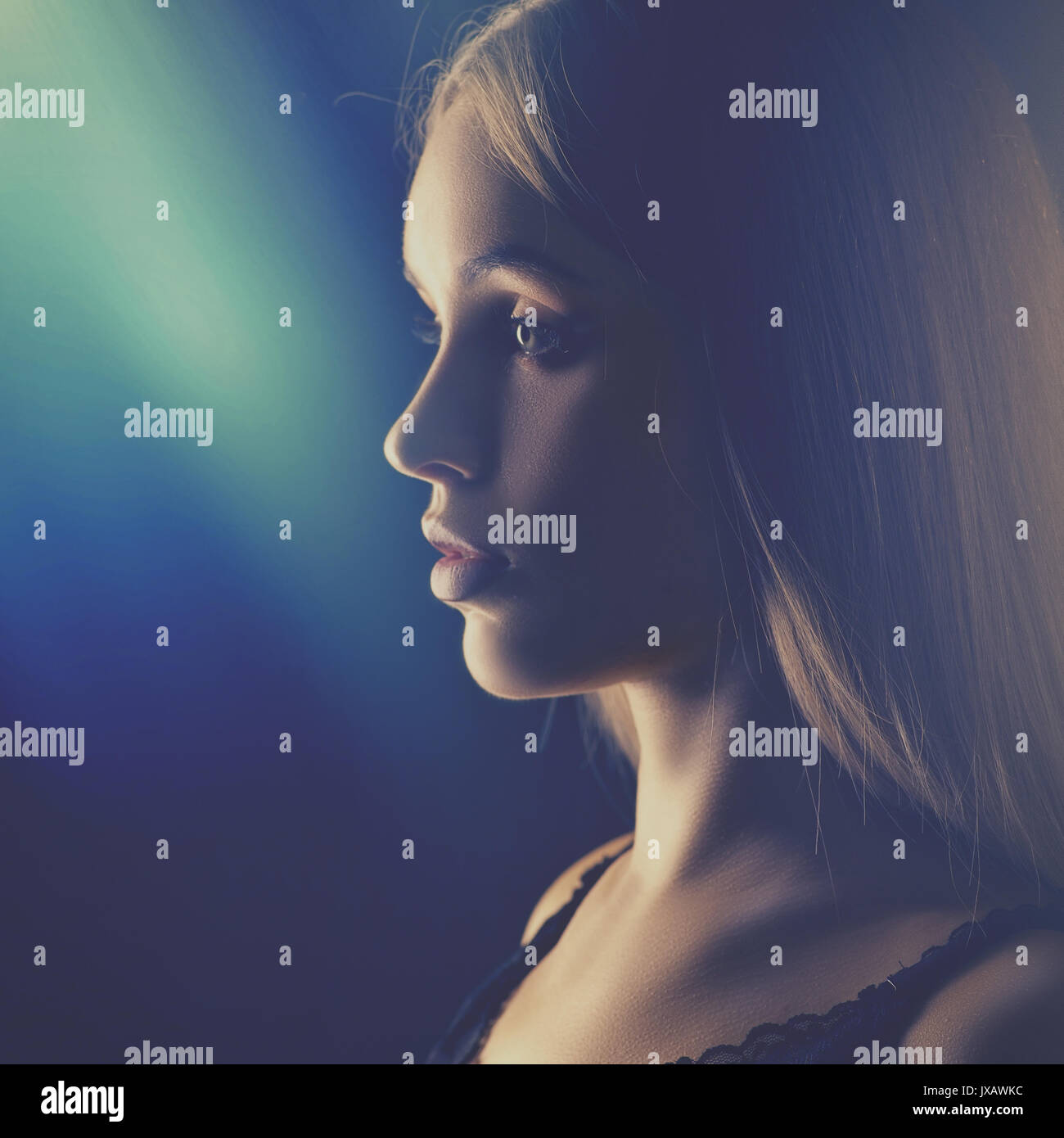 Dramatic female portrait with beauty lens flare Stock Photo - Alamy