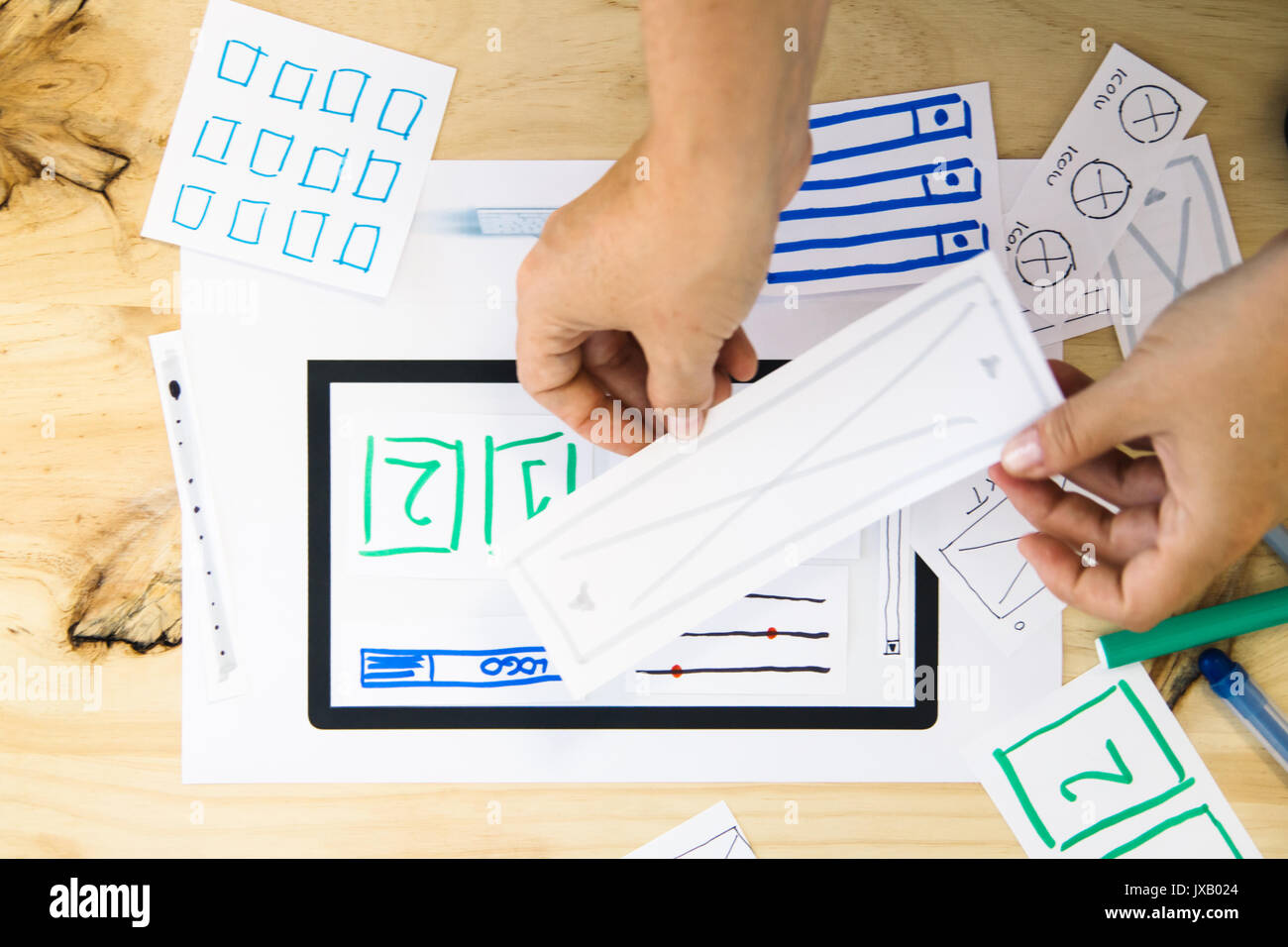 woman designing a wireframe for tablet app Stock Photo - Alamy