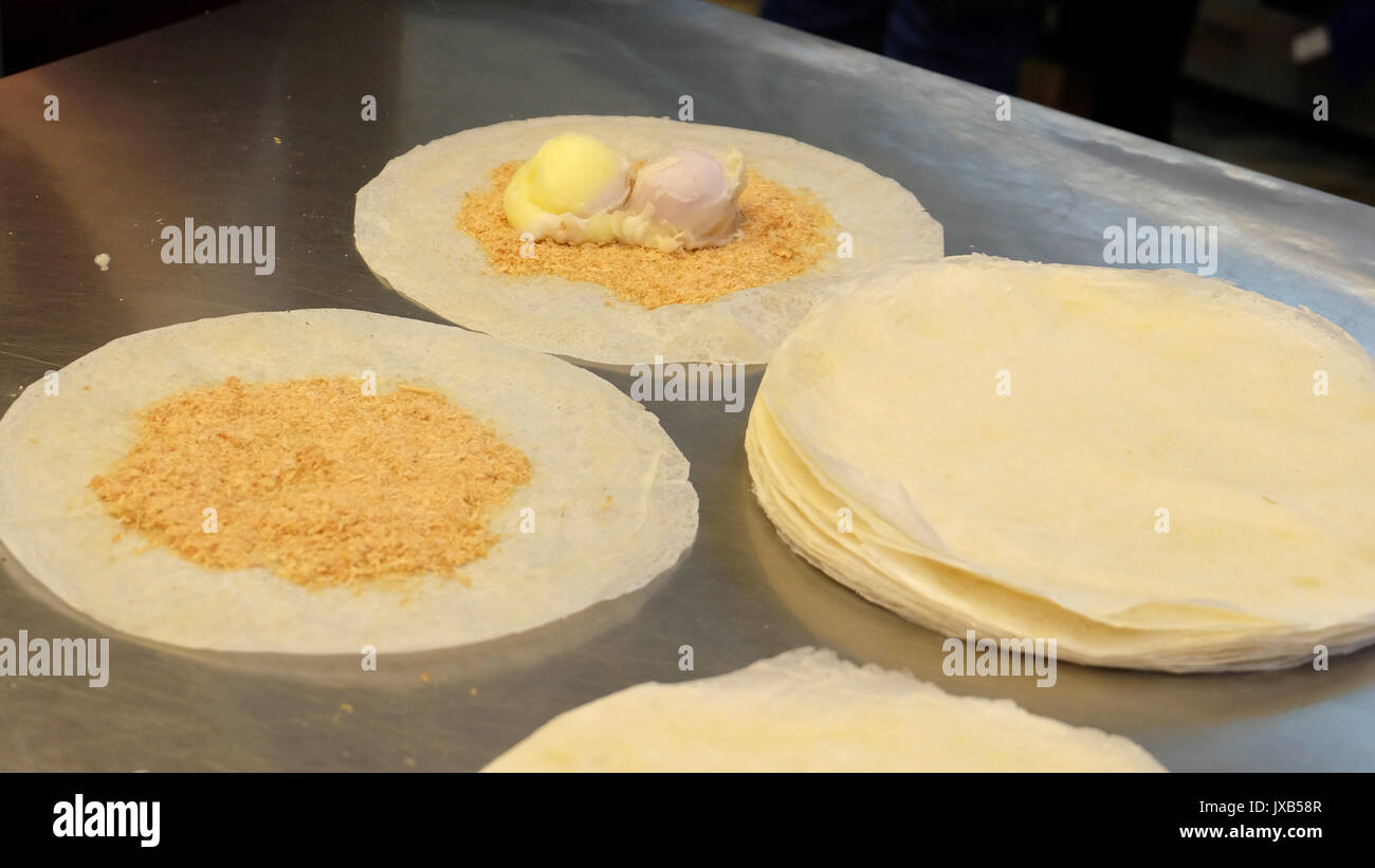 A Taiwan sweet desserts with crushed peanuts and ice-cream wrapped in a ...