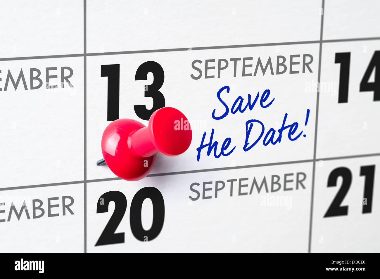 Wall calendar with a red pin - September 13 Stock Photo - Alamy