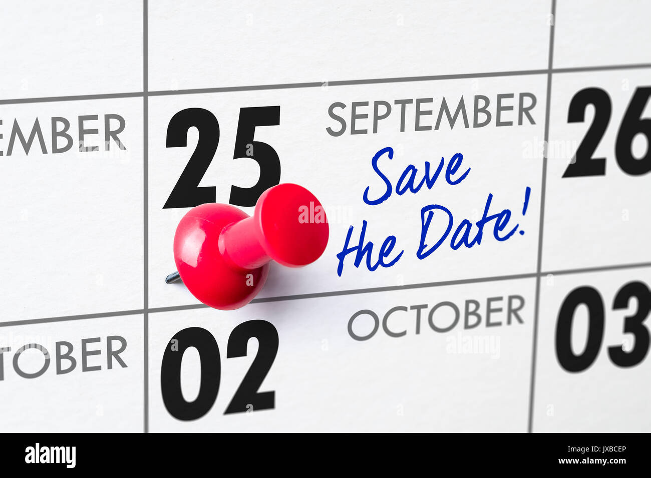 Wall calendar with a red pin - September 25 Stock Photo - Alamy