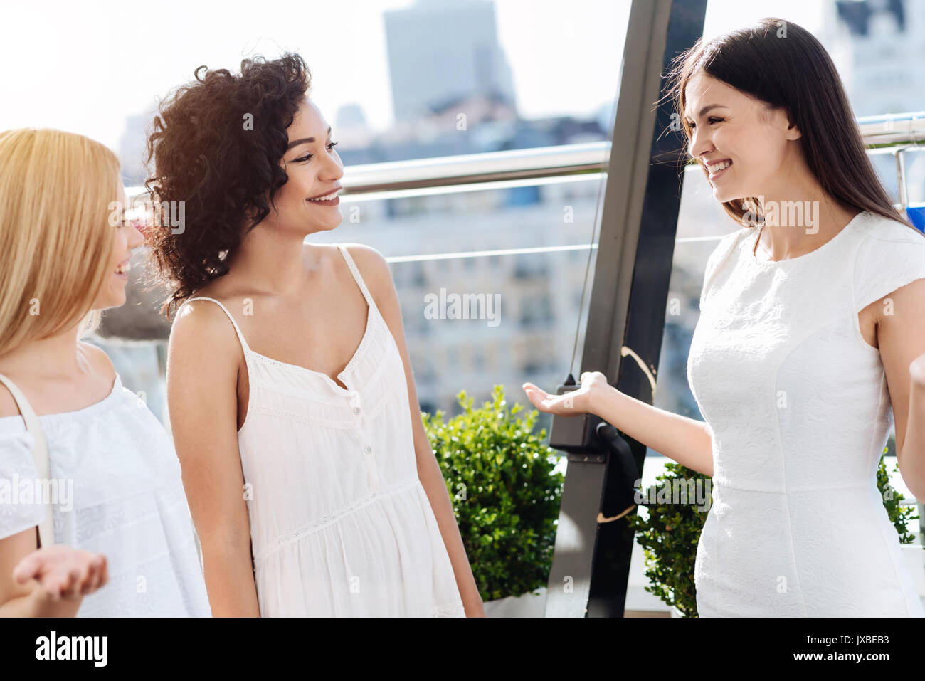 Joyful happy women meeting each other Stock Photo - Alamy