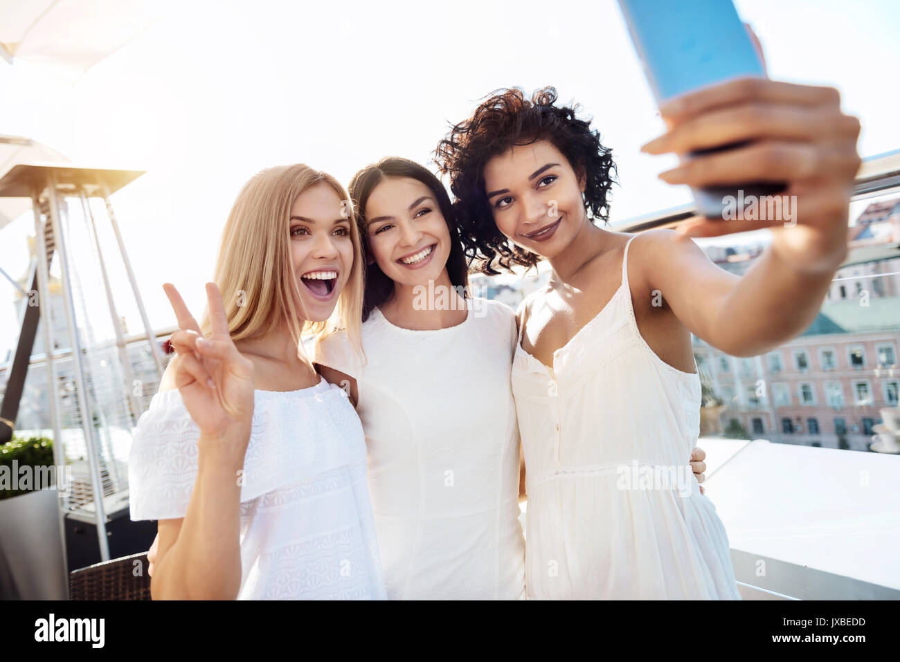 Happy joyful women posing for a photo Stock Photo - Alamy